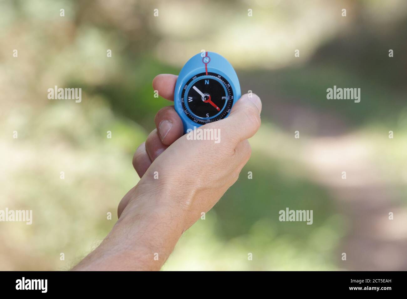 close up of a compass in the hand Stock Photo - Alamy