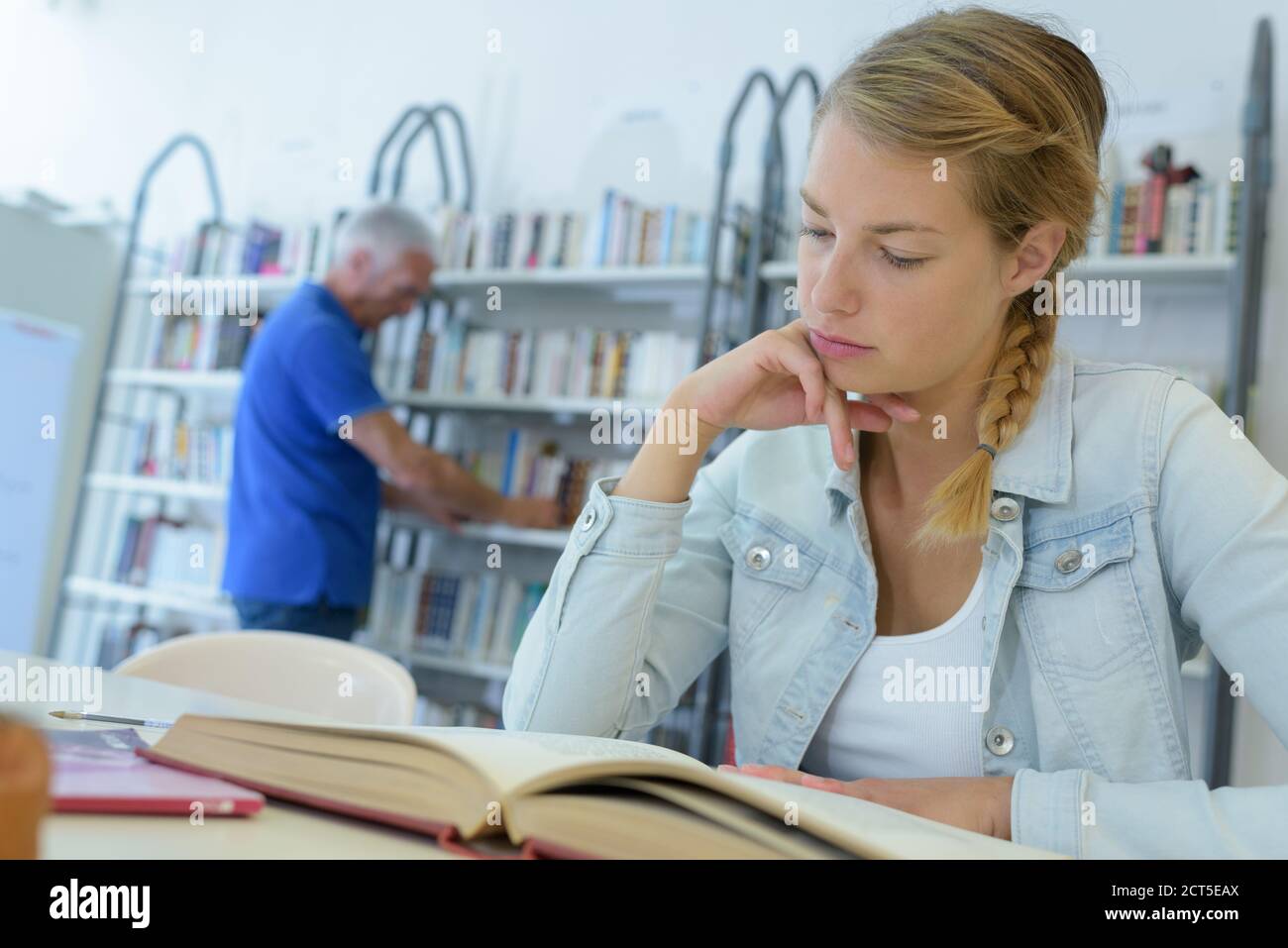 woman studying in the library Stock Photo - Alamy
