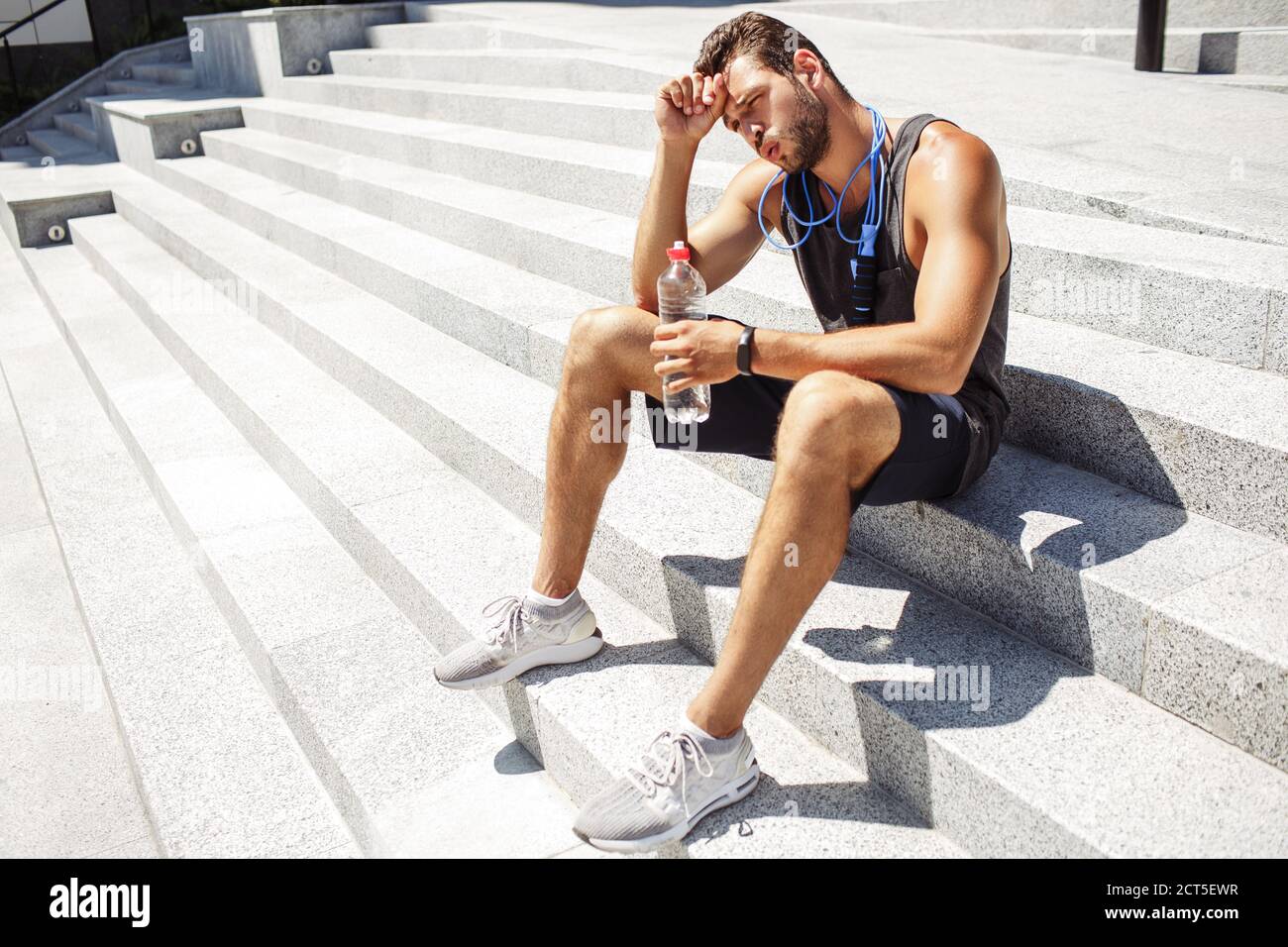 Man resting after jumping rope hi-res stock photography and images - Alamy