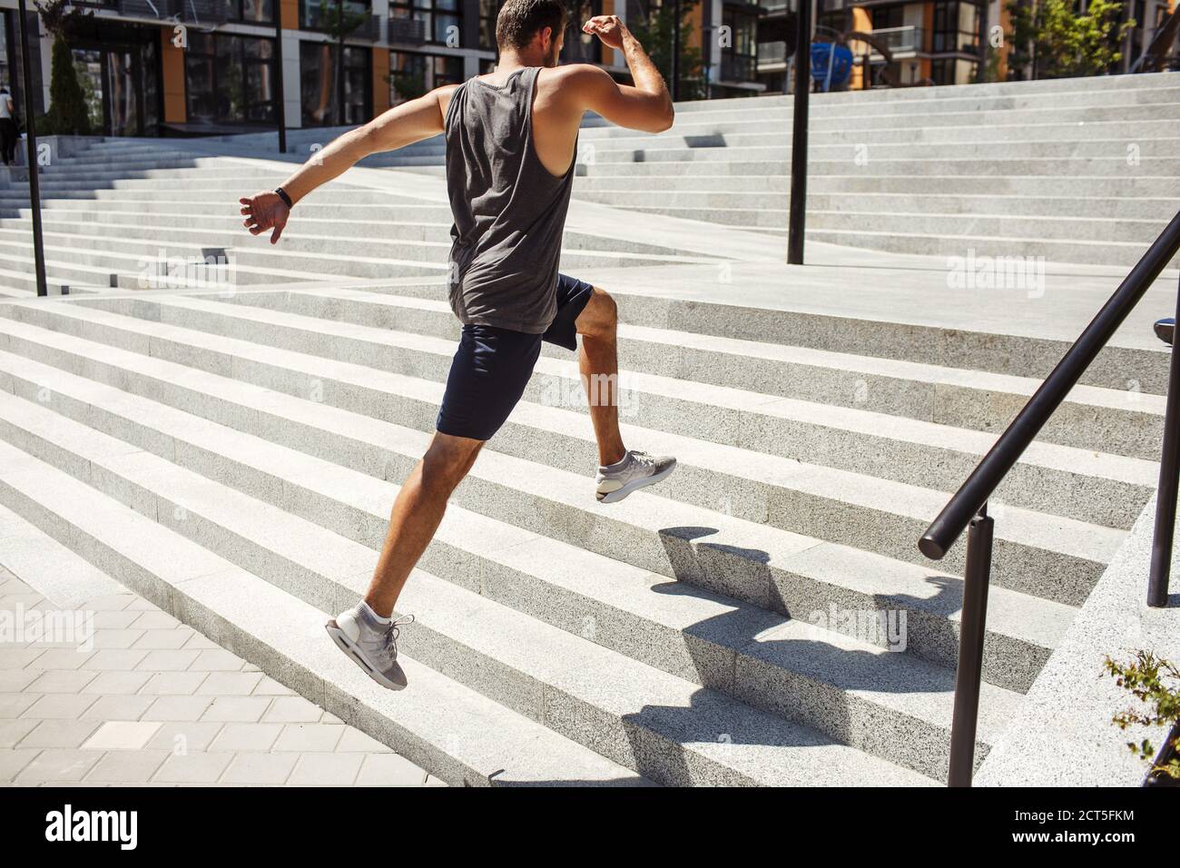 Picture of a young man jumping on the beach Stock Photo - Alamy