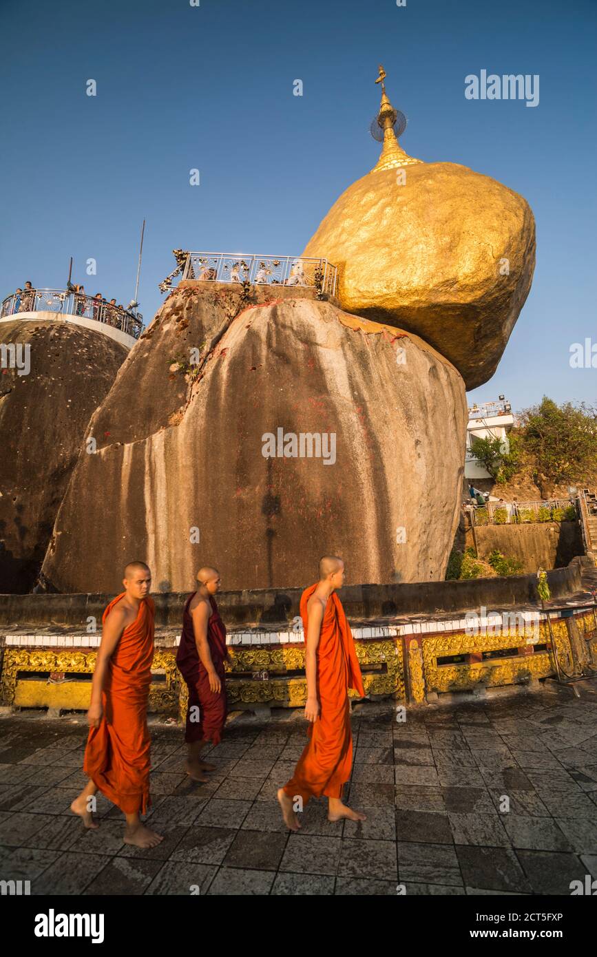 Buddhist monks at Golden Rock Stupa (Kyaiktiyo Pagoda) at sunset, Mon ...