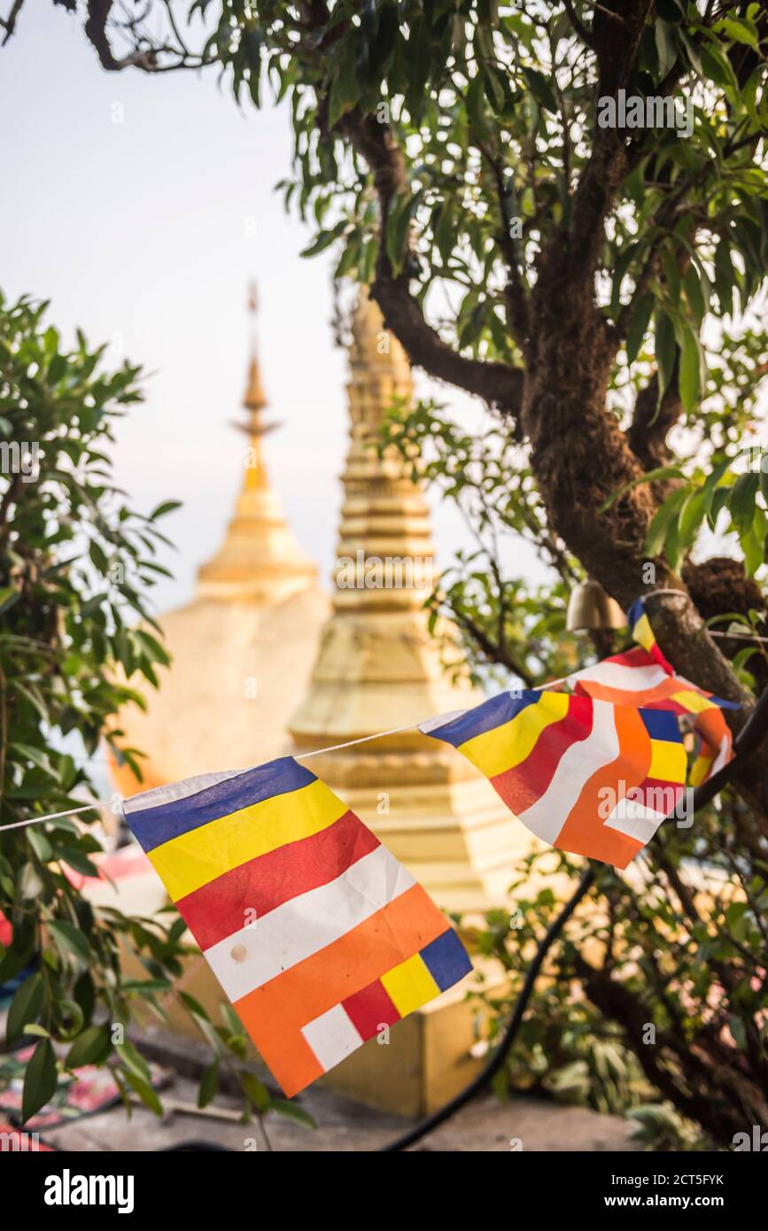 Buddhist prayer flags at Golden Rock (Kyaiktiyo Pagoda), Mon State ...