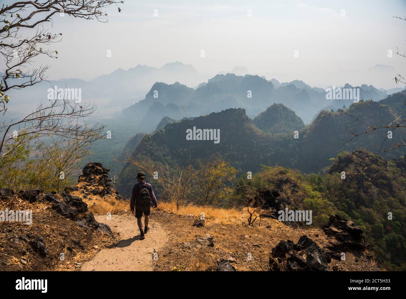 Tourist climbing Mount Zwegabin at sunrise, Hpa An, Kayin State (Karen ...