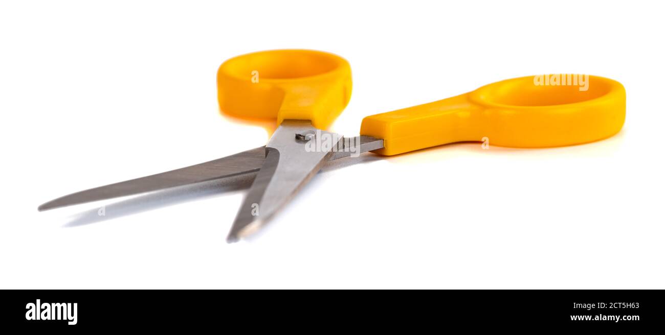 Yellow scissors isolated on a white background Stock Photo - Alamy