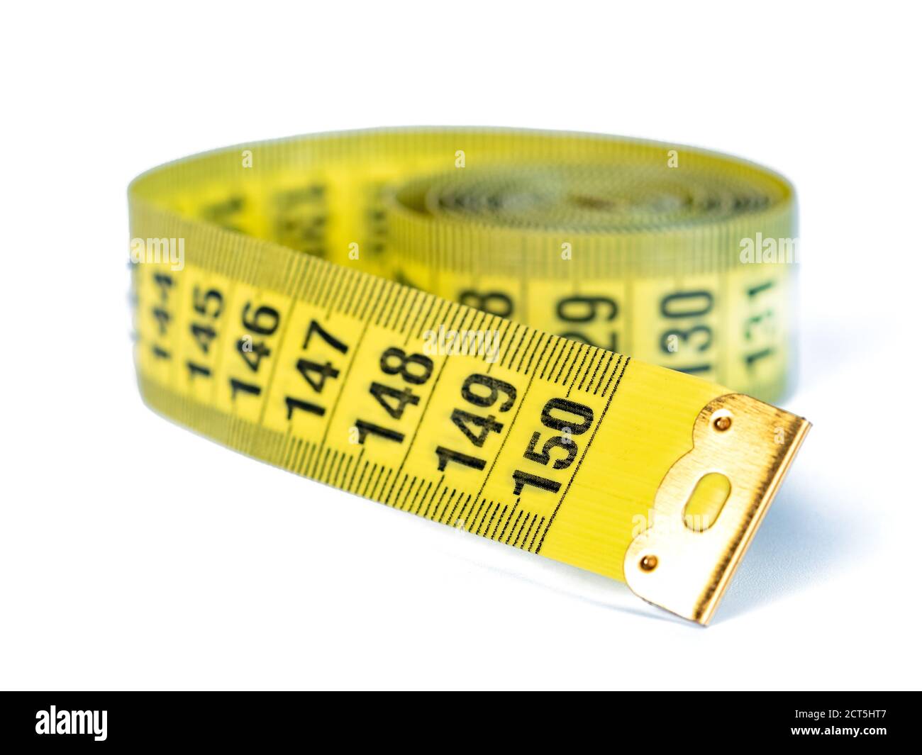 Yellow measuring tape isolated on white background Stock Photo - Alamy