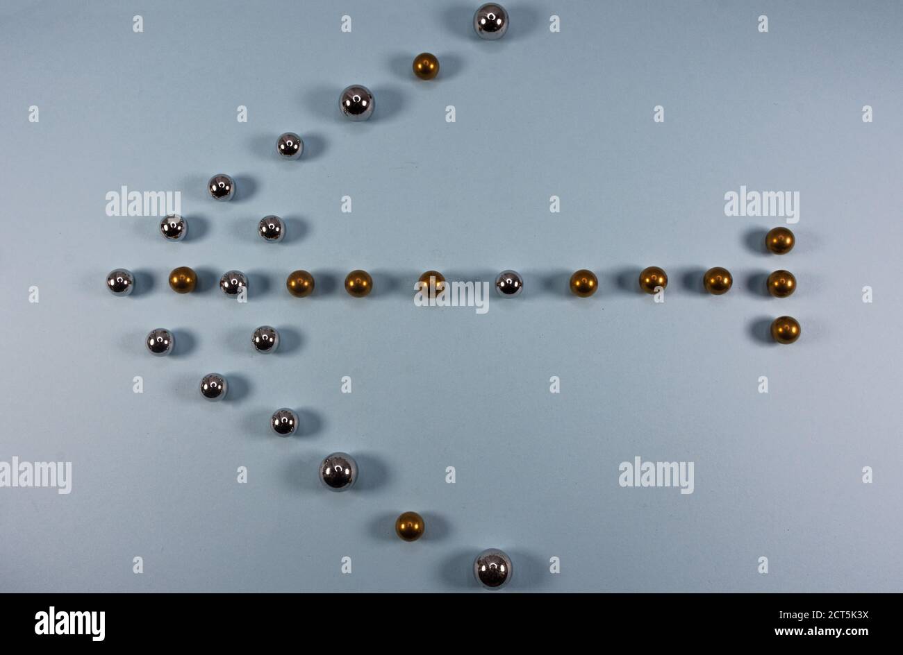 Direction arrows made with metal balls Stock Photo - Alamy