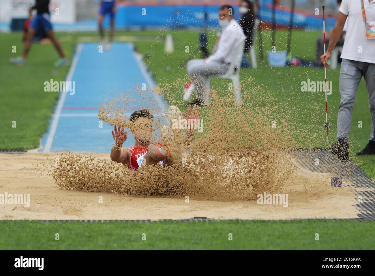 ISTANBUL, TURKEY - SEPTEMBER 13, 2020: Undefined athlete triple jumping ...