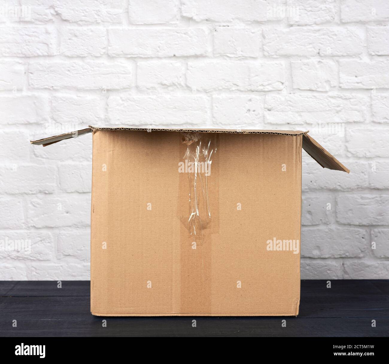 open empty rectangular box made of brown corrugated cardboard on a ...