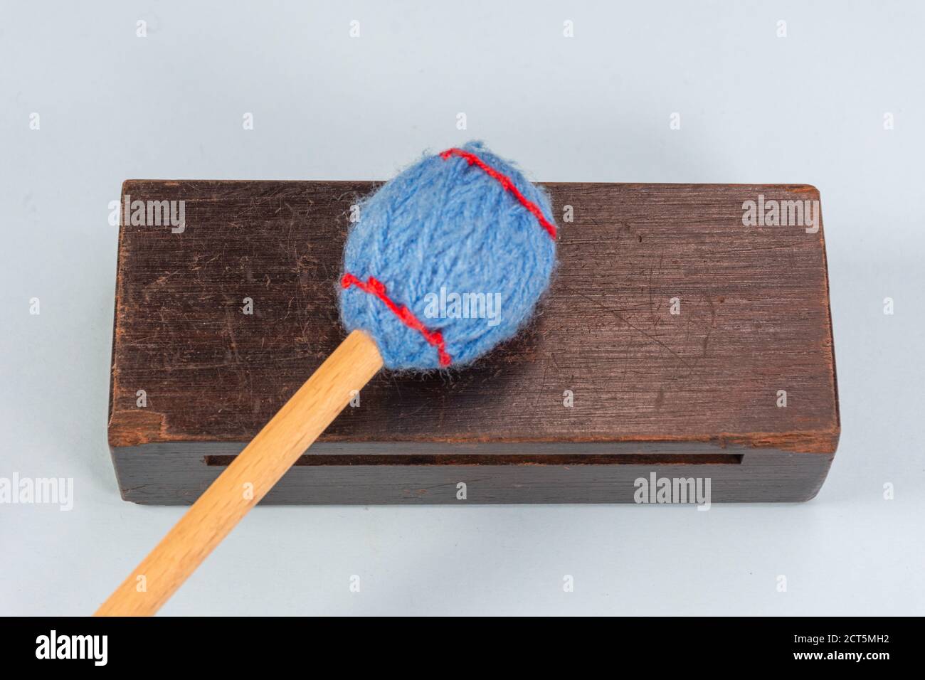 Mallet play a wood block of wood Stock Photo - Alamy