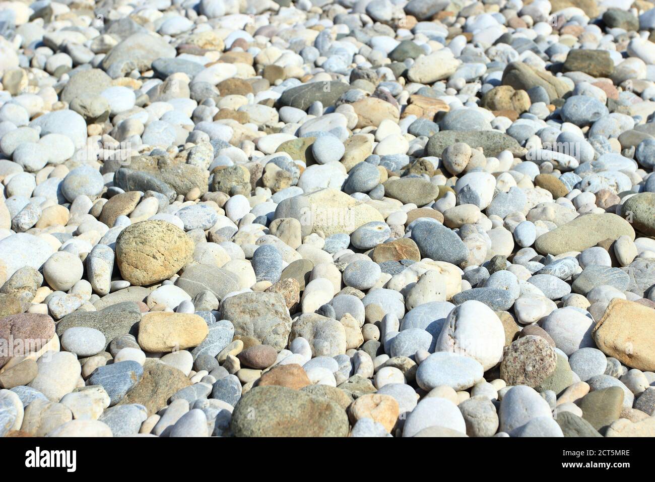 Colorful rounded rocks, pebbles on the river coast Stock Photo - Alamy