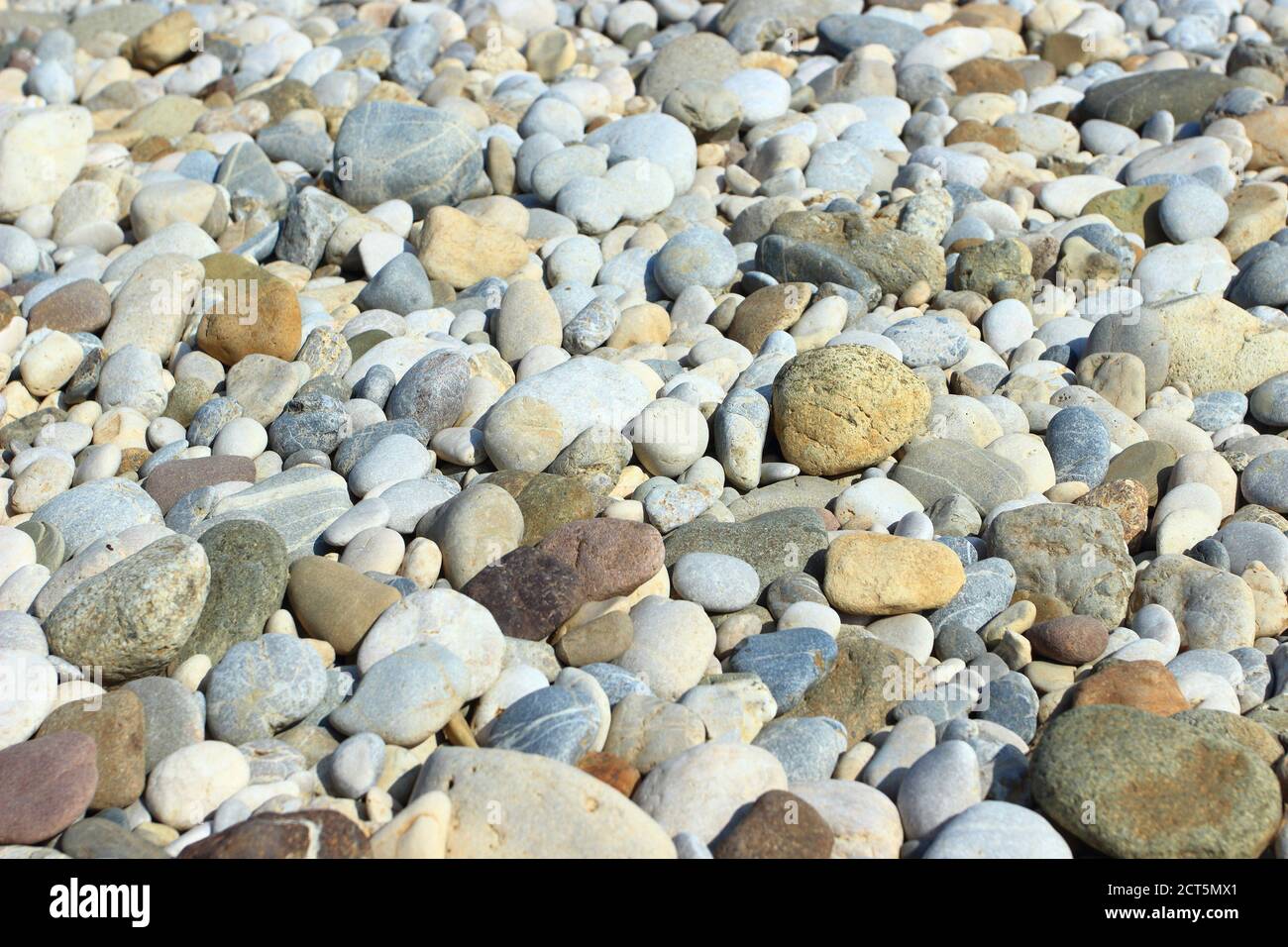 Colorful rounded rocks, pebbles on the river coast Stock Photo - Alamy