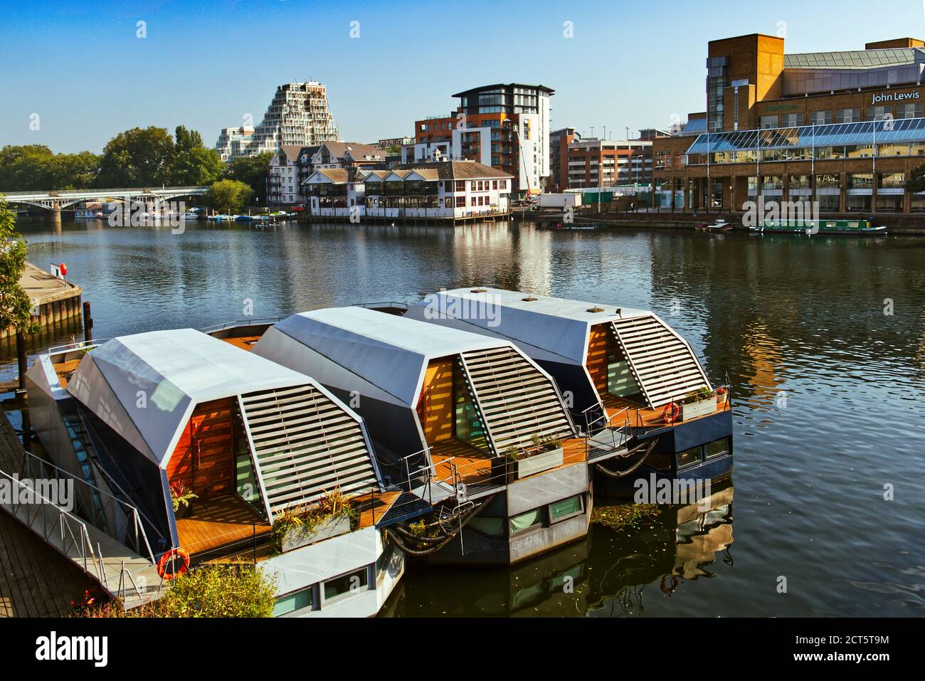 Modern houseboats moored on the River Thames at Kingston upon Thames ...