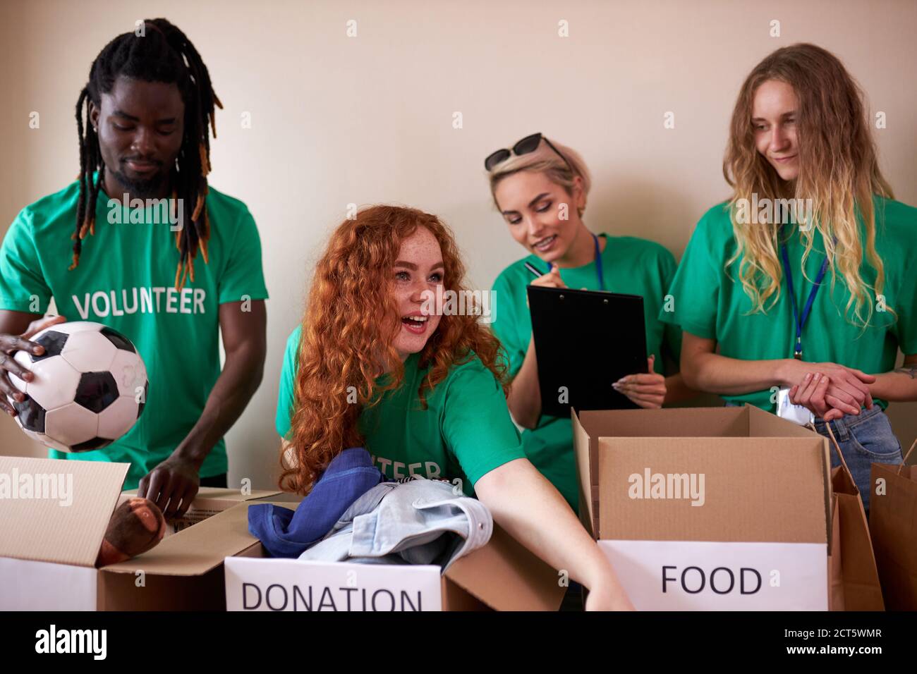 group of diverse people working in charitable foundation, happy ...