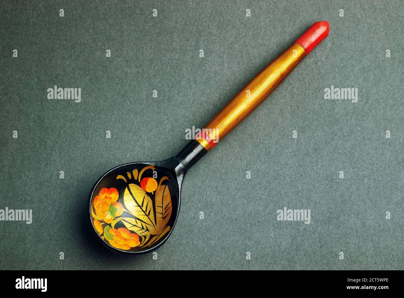 Russian national artistic wooden spoon on black paper texture Stock ...