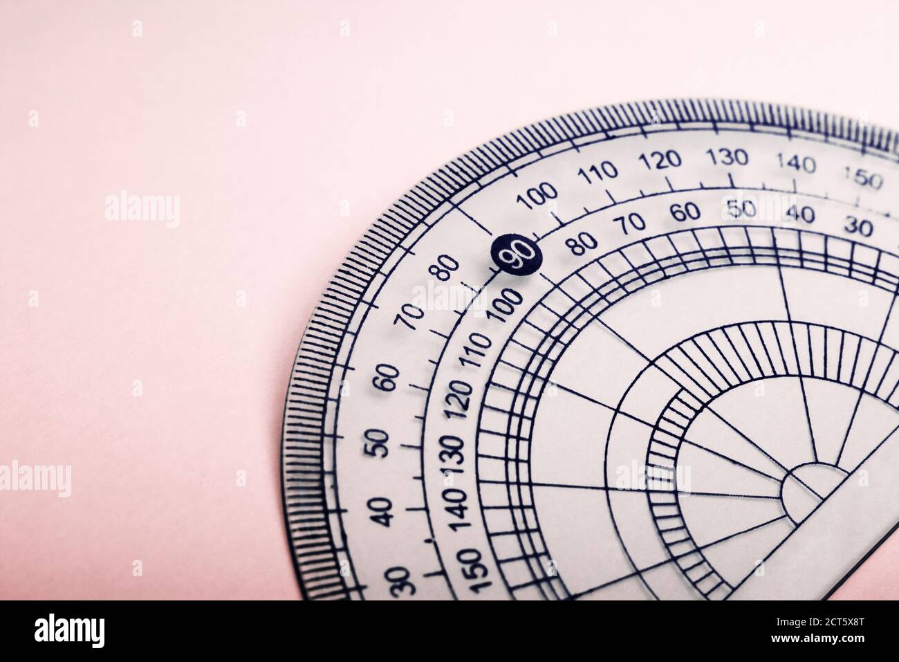 Closeup of transparent black protractor on red paper texture Stock ...