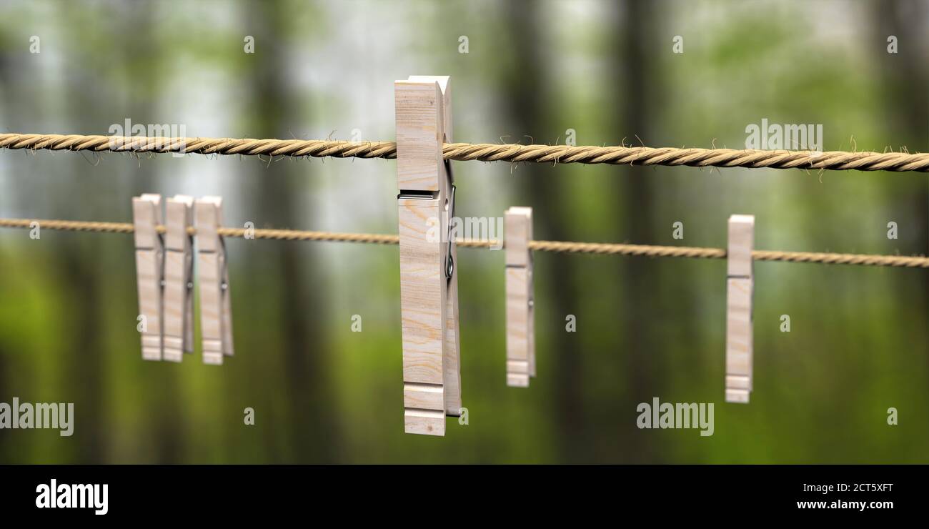 Clothespins on clothes rope against blur green nature background ...