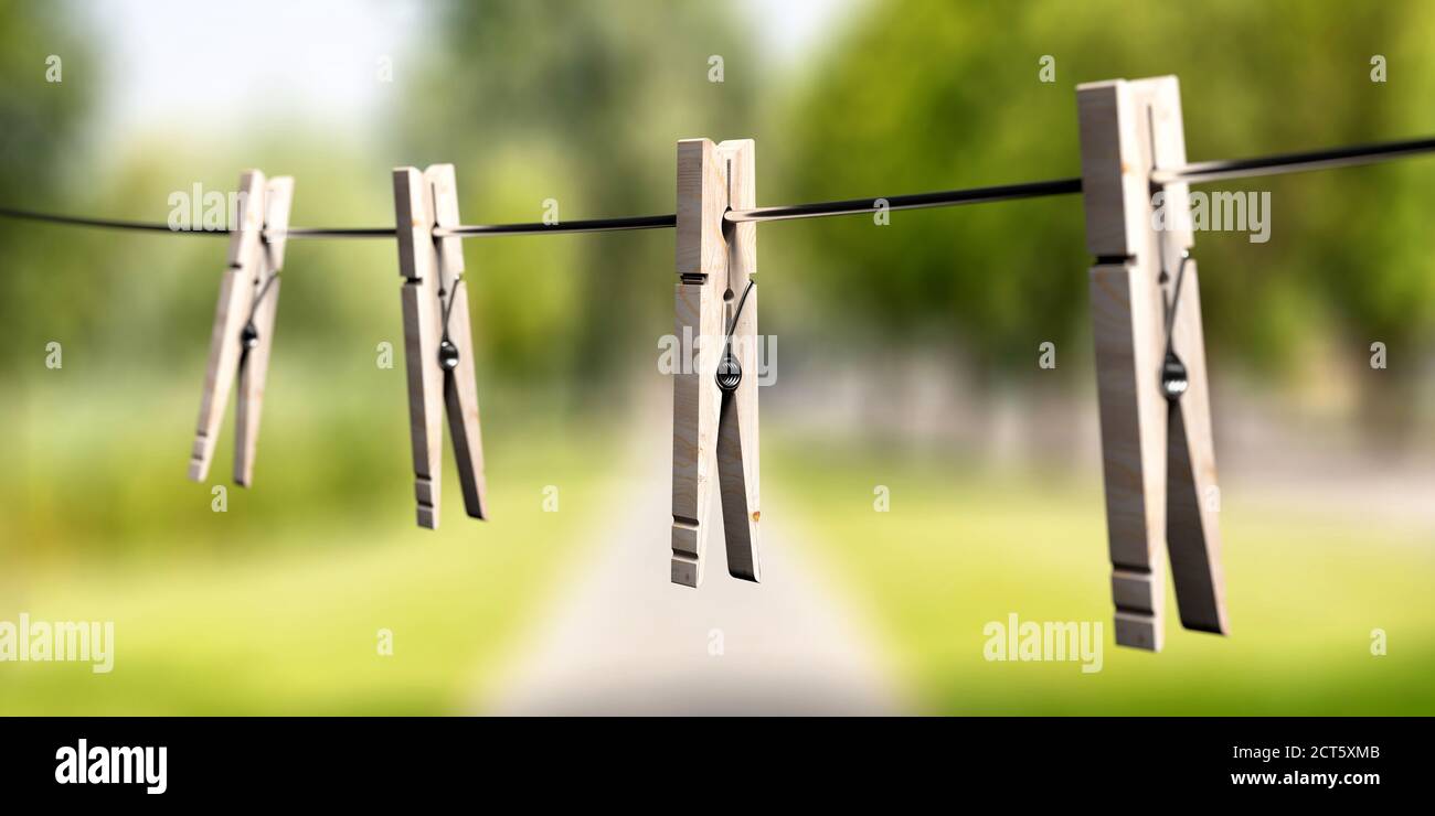 Clothespins on clothes cord against blur green nature background ...