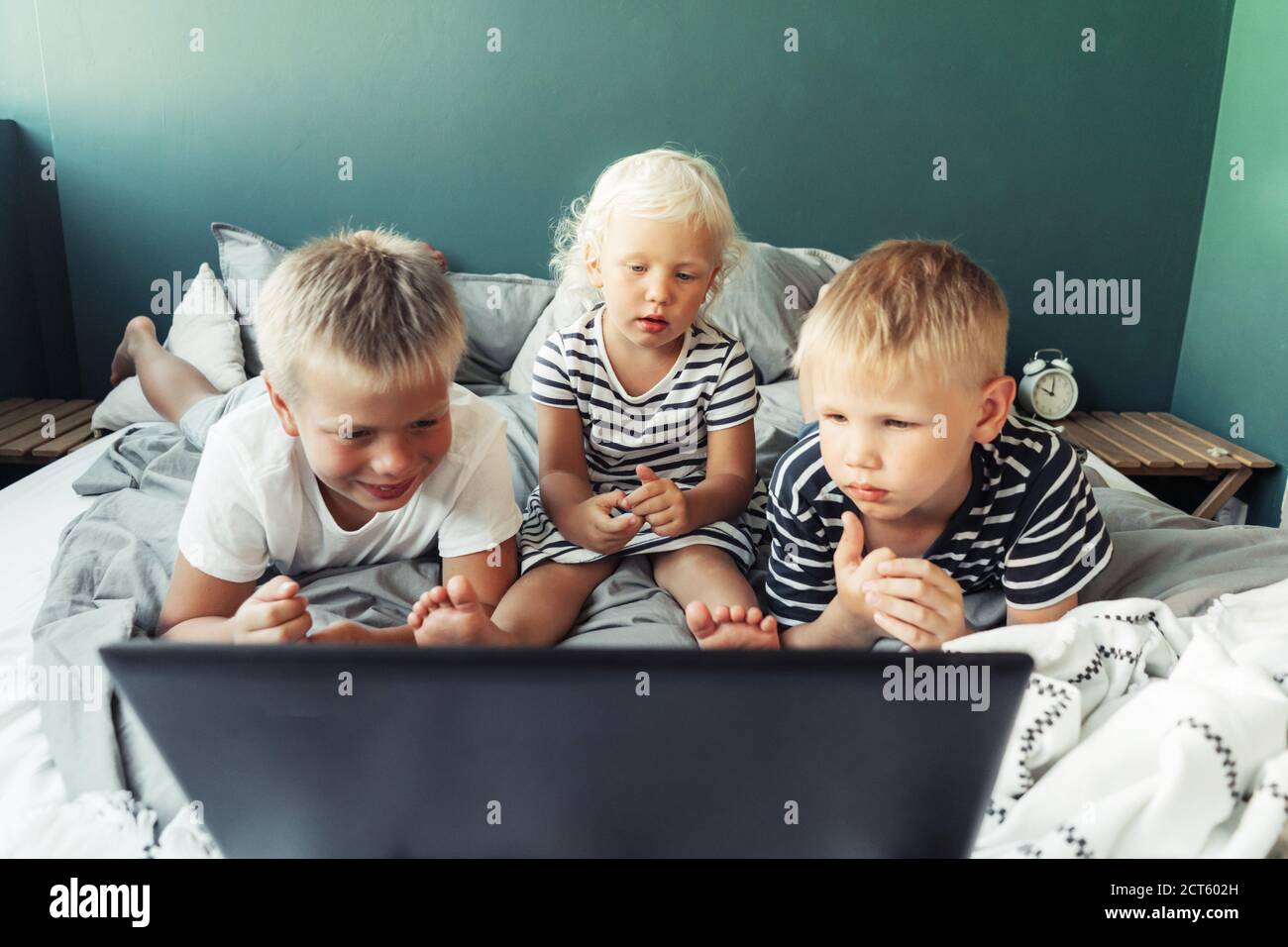 Children look at the laptop screen Stock Photo - Alamy