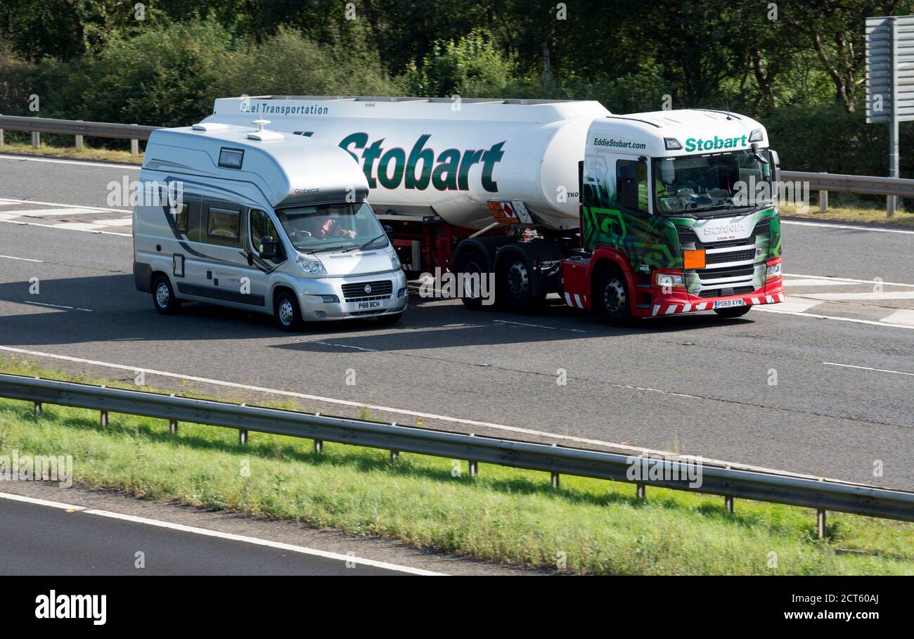A Globecar hire motorhome alongside a Stobart tanker lorry on the M40 ...