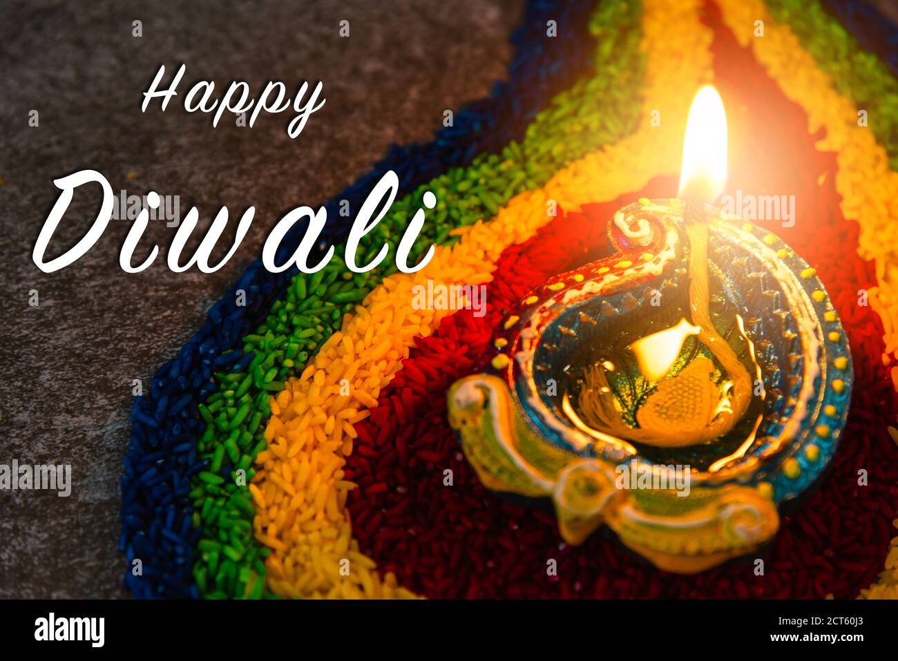 Close up clay lit light a fire already on Diya or oil lamp on concrete ...