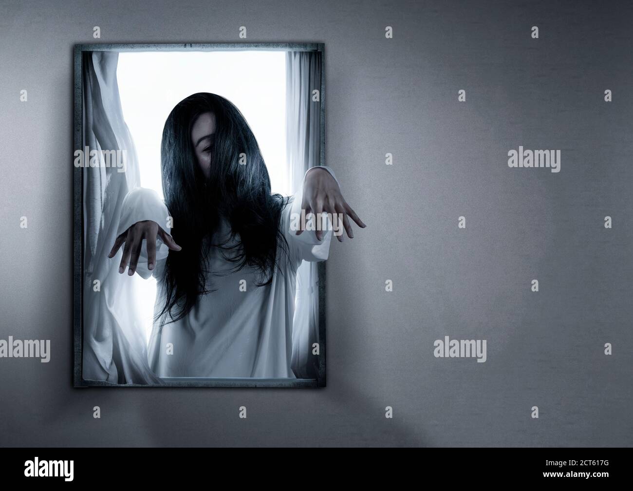 Scary ghost woman standing on the window in the abandoned house ...