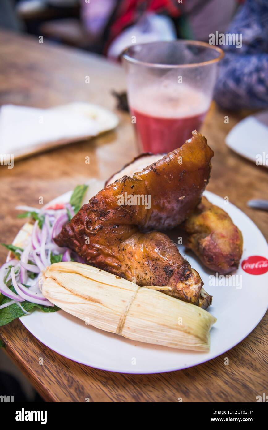 Pork and Tamale (steamed and boiled corn-based dough), a traditional ...