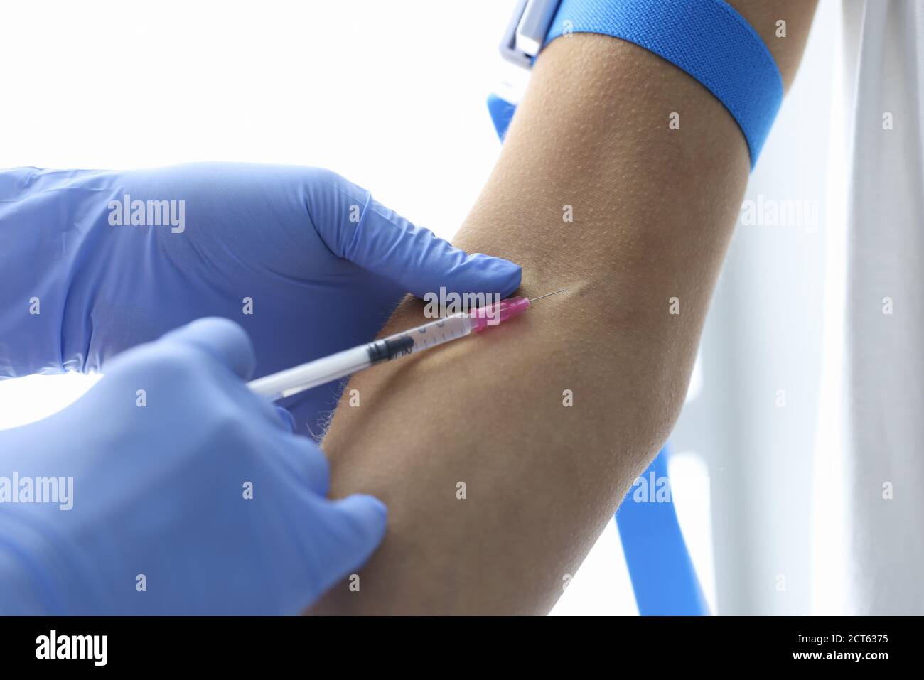 Nurse in rubber gloves makes intravenous injection closeup Stock Photo ...