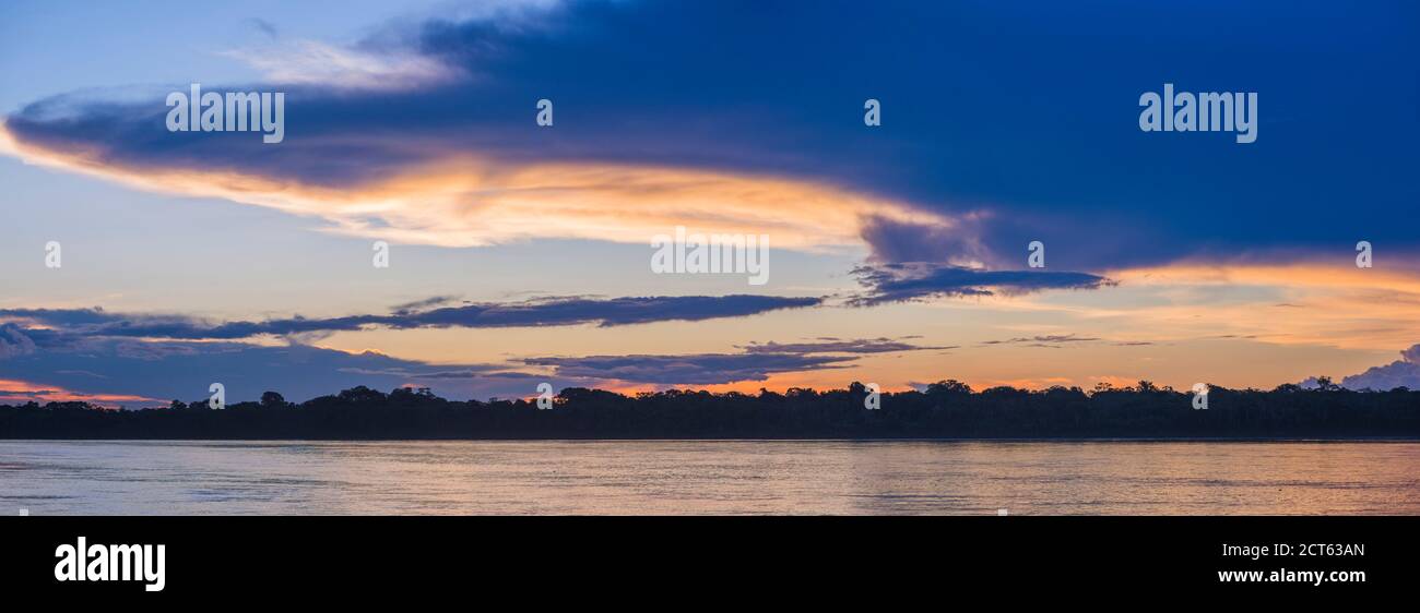 Sunset over river in Amazon Jungle of Peru, Tambopata National Reserve ...