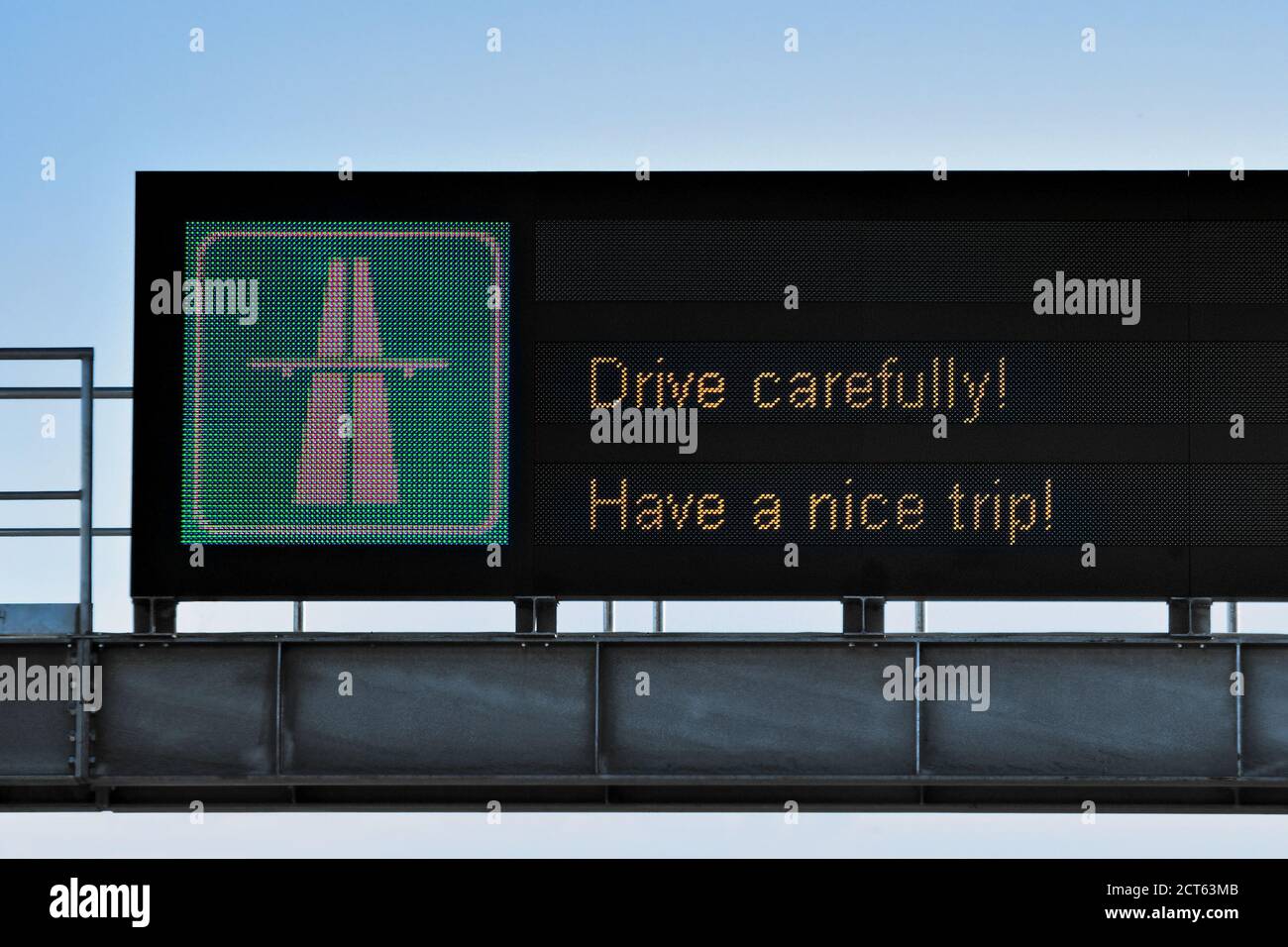 Led road sign billboard on a highway, green motorway road sign, drive ...