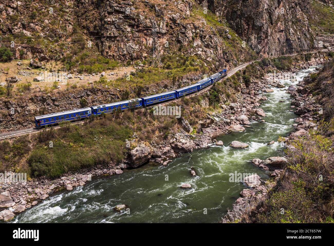 Train between Machu Picchu at Aguas Calientes and Ollantaytambo through ...