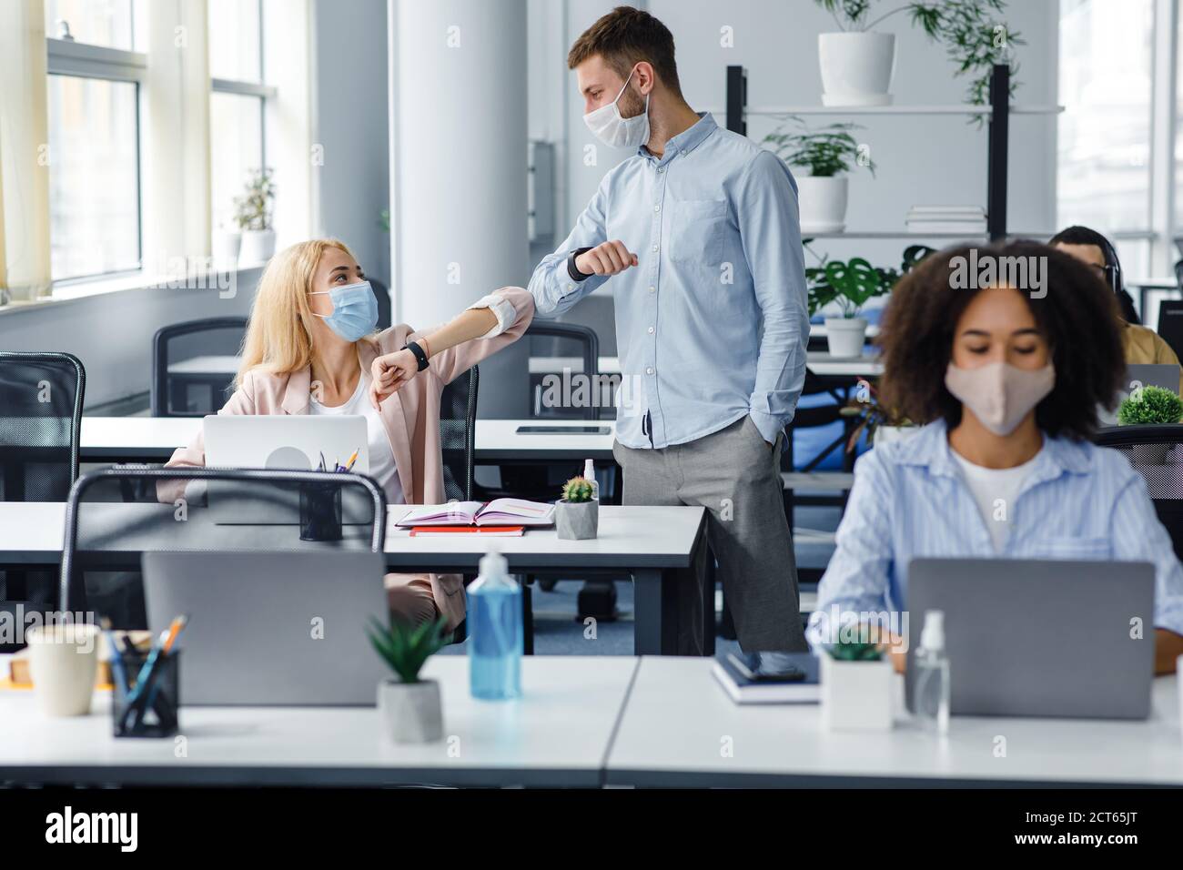 New normal and coworking. Friendly smiling millennial colleagues ...