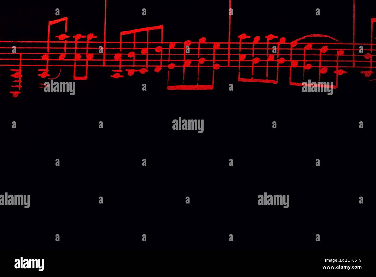 stylized red musical notes on black with copy space Stock Photo - Alamy