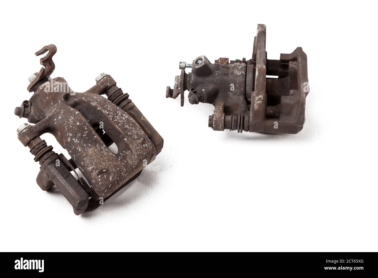 Close up old, worn out and rusty car caliper of brake system on white ...