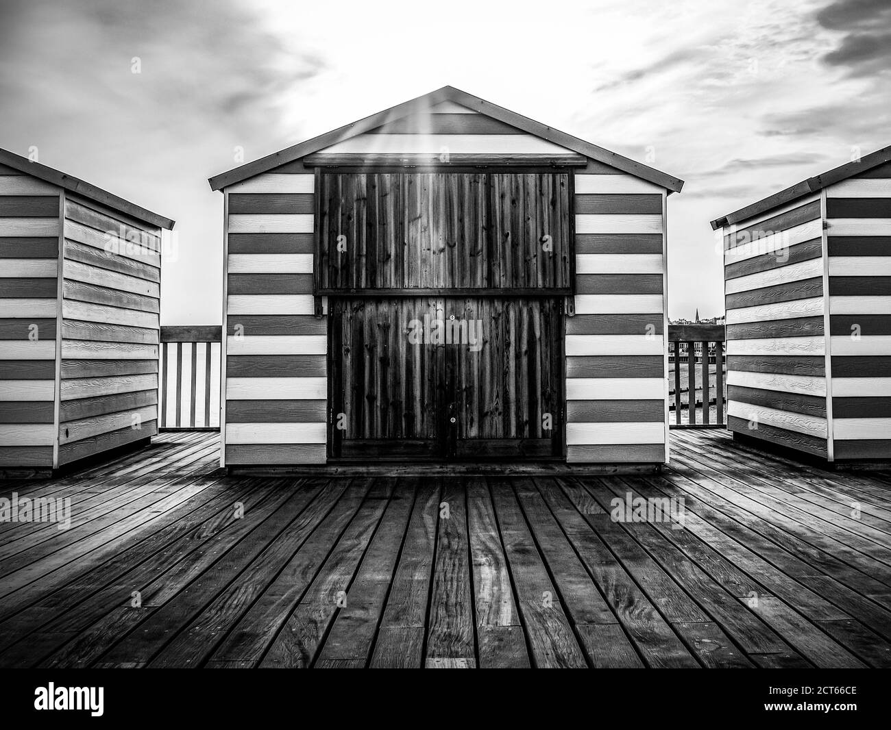 Beach hut with sun setting from behind, in Black and White on Hastings ...
