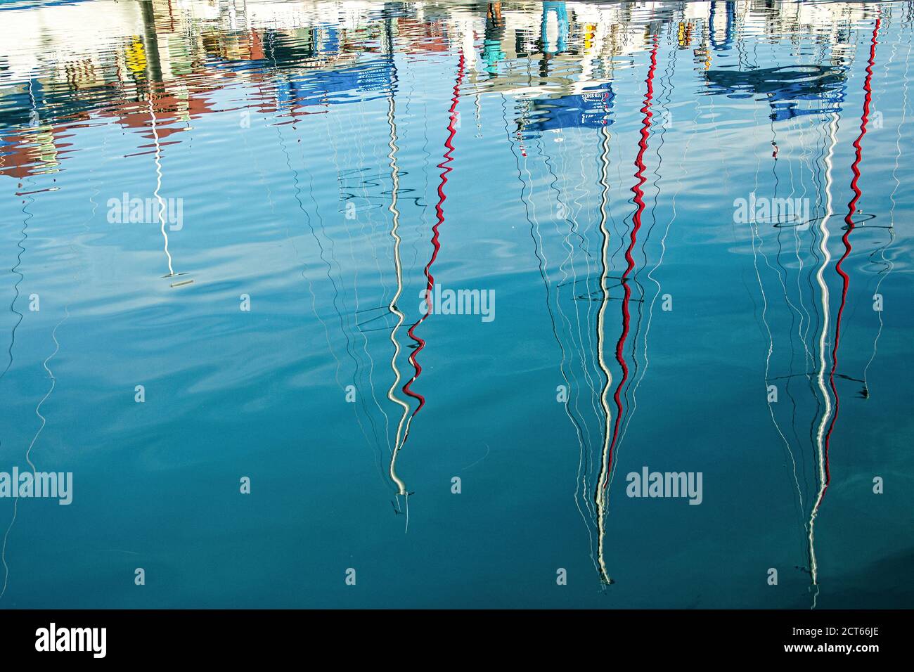 Ripples in the water with boat musts reflection Stock Photo - Alamy