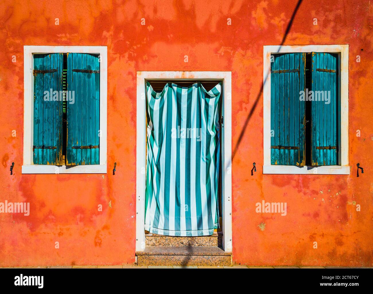 Old Orange house with entrance Stock Photo - Alamy