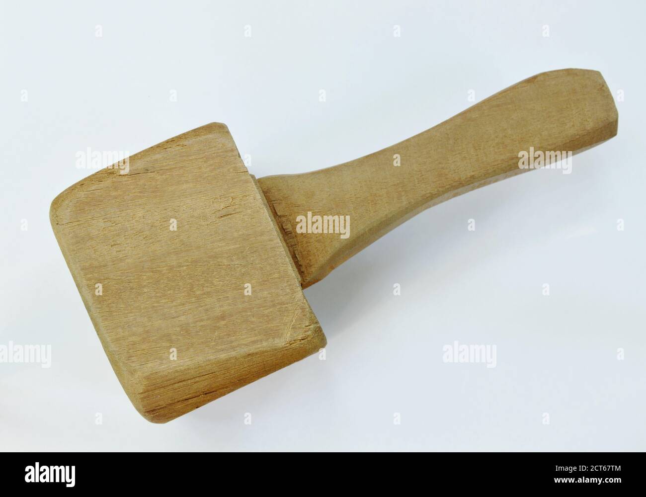 Big and heavy wooden hammer on white background Stock Photo - Alamy