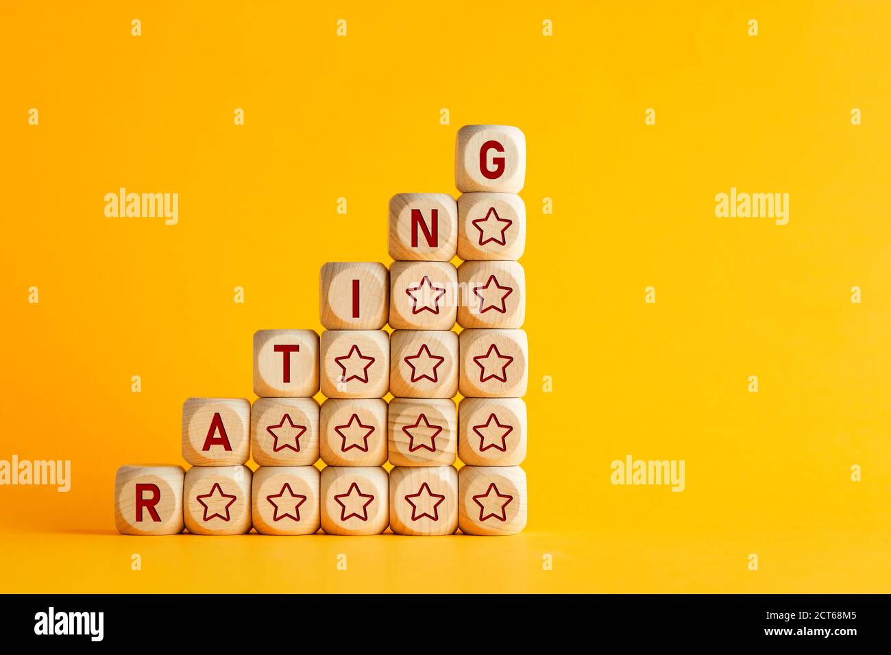 The word rating with increasing performance stars on wooden cubes ...