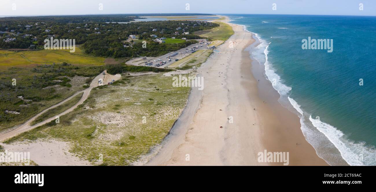 The Atlantic Ocean washes onto a scenic, sandy beach on Cape Cod ...