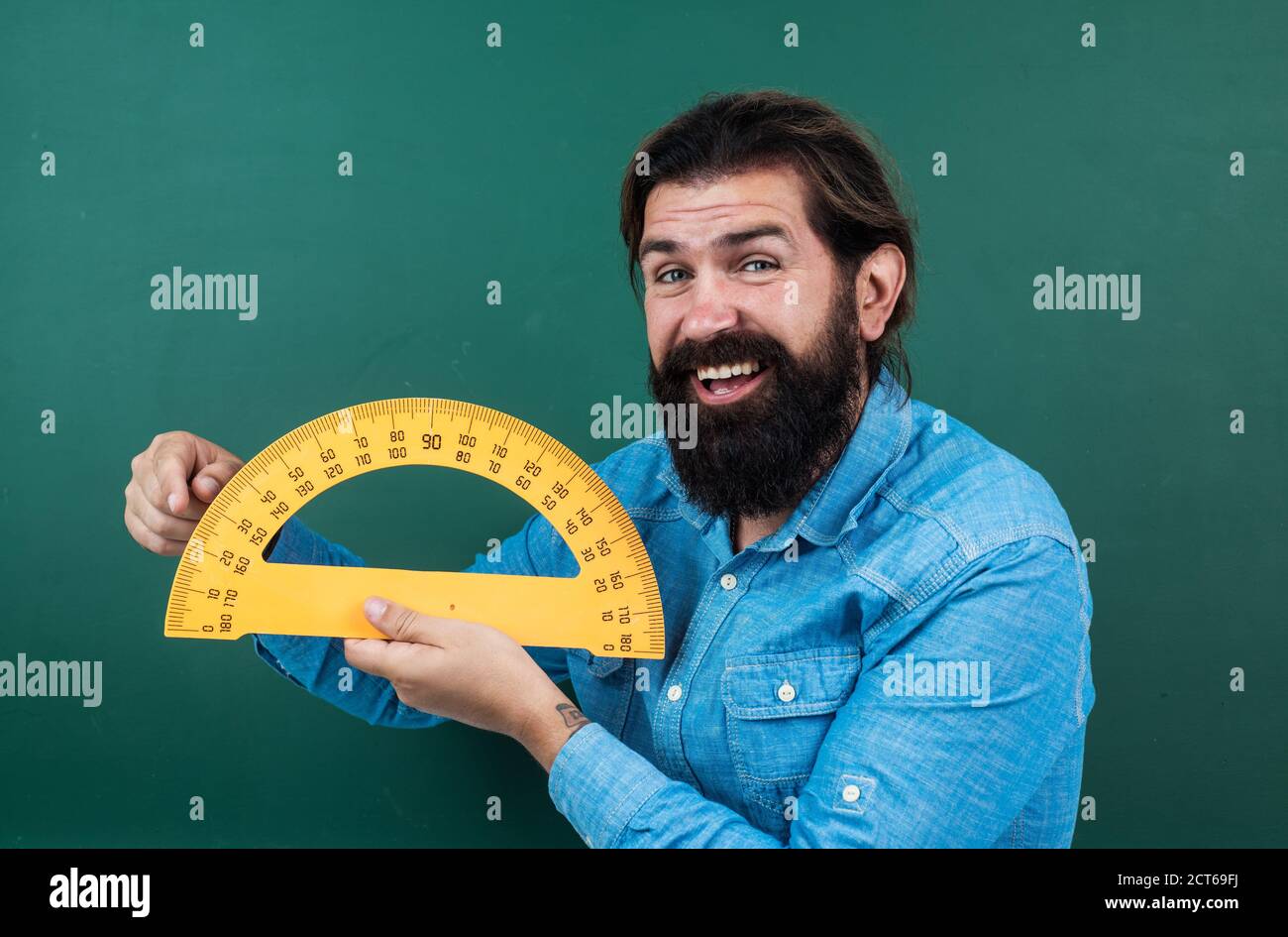 studying the measurement. formal education. male student at mathematics ...