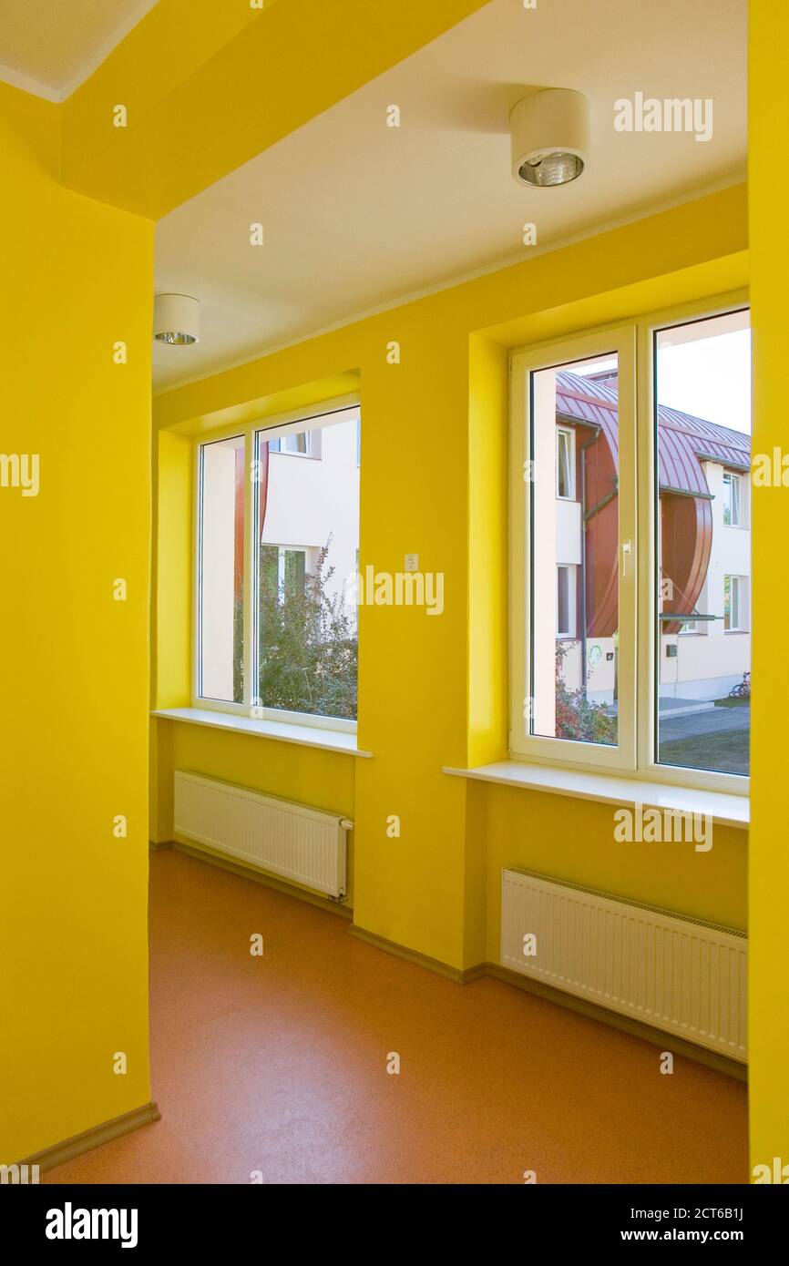 Yellow Hallway of a School Stock Photo - Alamy