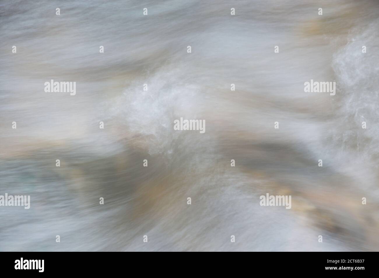 Blurry water flowing on the rock and wave splashing in river Stock ...