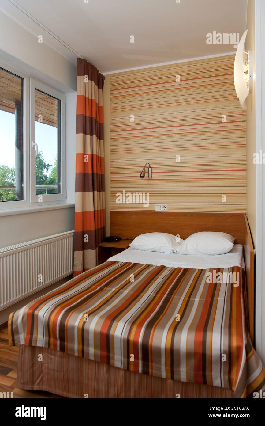 Small and Colorful Hotel Room Stock Photo - Alamy