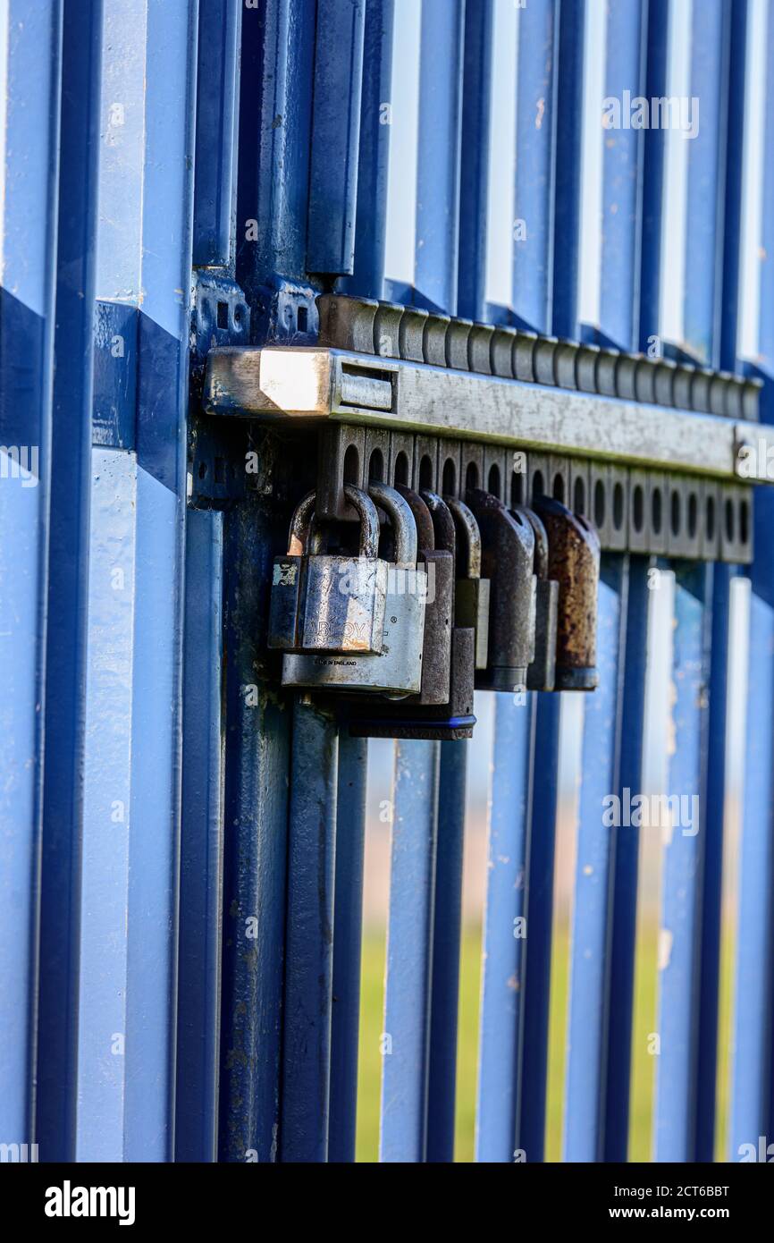 Lots of padlocks used to secure a gate to a telecoms tower Stock Photo ...
