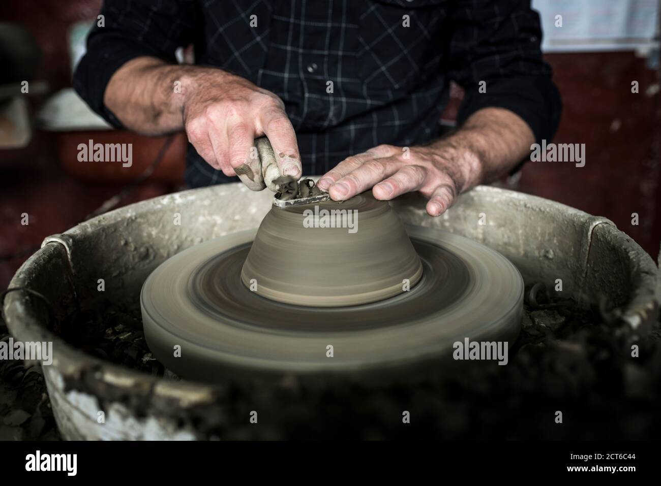 Throwing a pot on a pottery wheel at a Marginea Black Pottery and ...