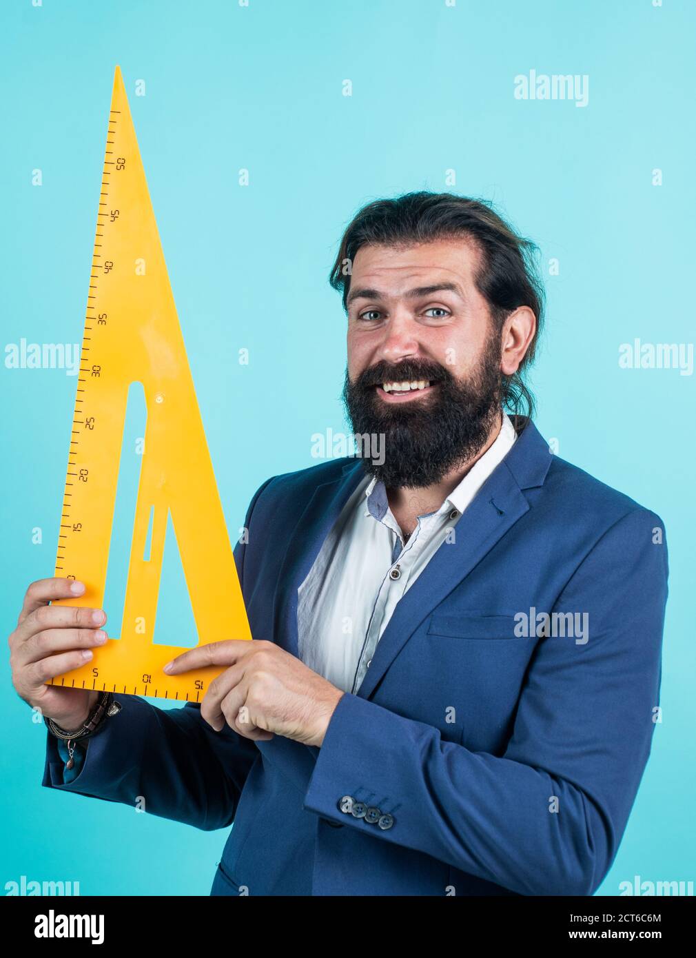 studying the measurement. formal education. male student at mathematics ...