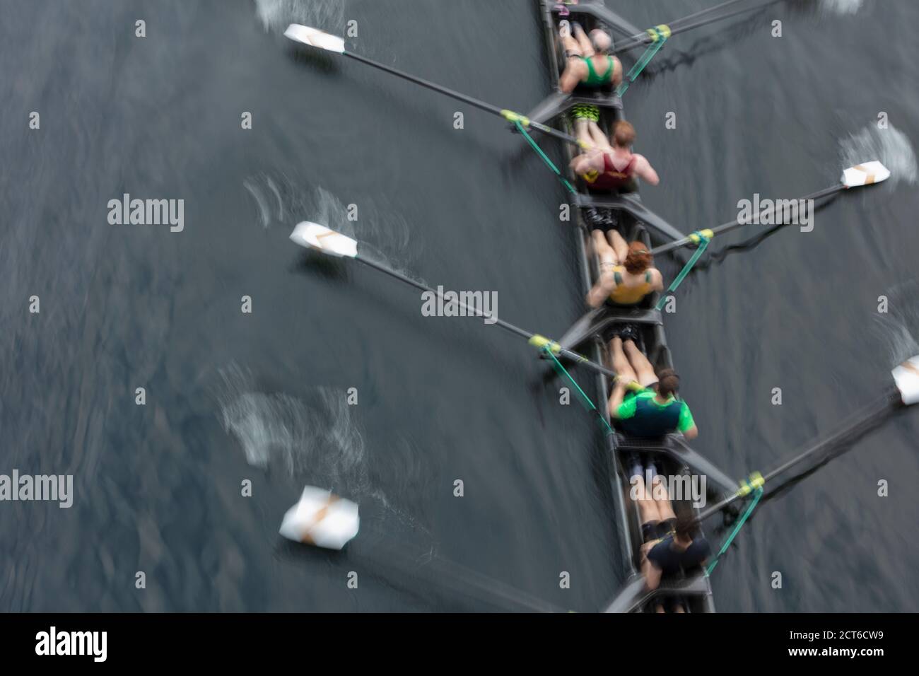 Overhead view of a crew rowing in a four on the surface of a lake Stock ...