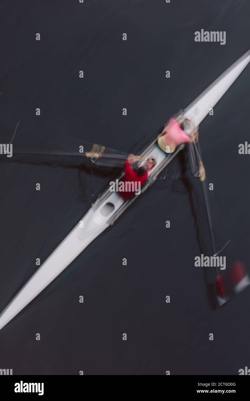Overhead view of two people rowing in a scull, a pair in a boat Stock ...
