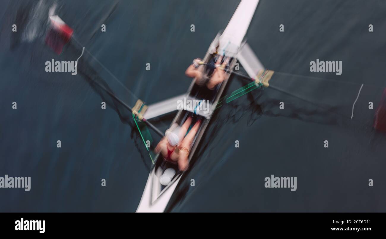 Overhead view of two people rowing in a scull, a pair in a boat Stock ...
