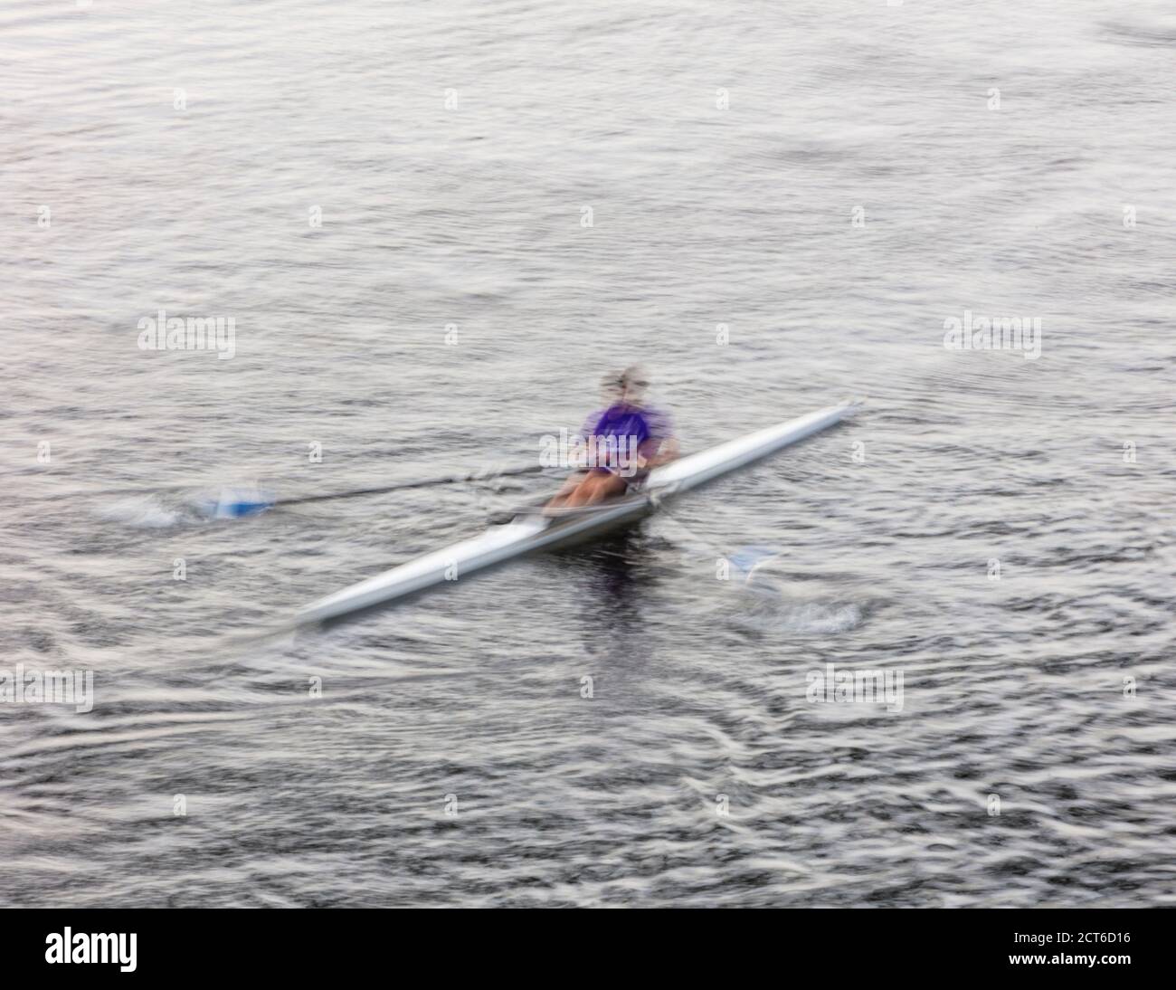 A single scull boat and rower on the water, view from above Stock Photo ...